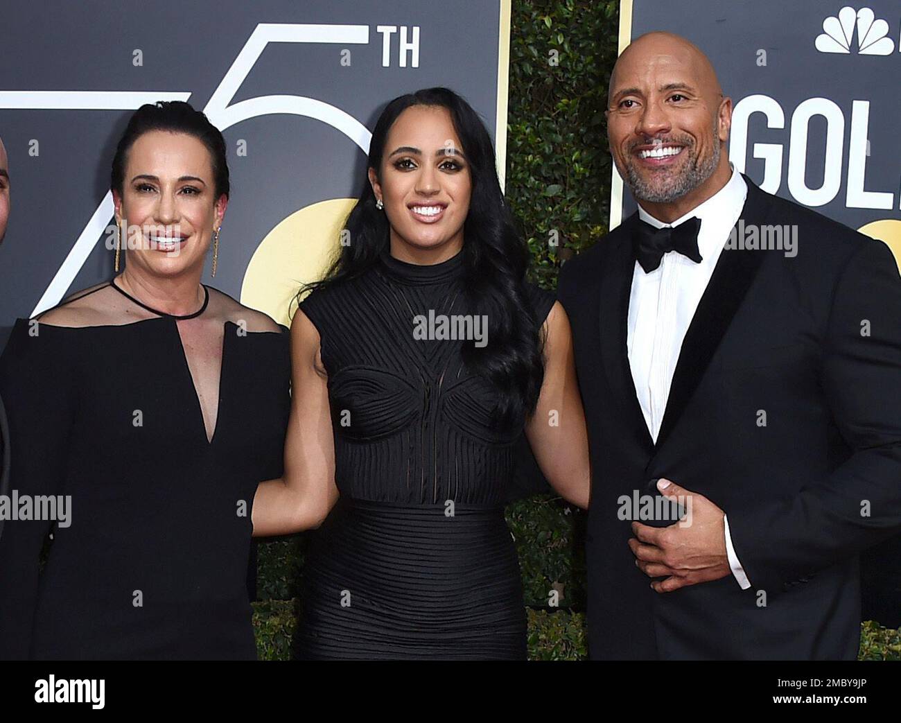 FILE - Dwayne Johnson, right, appears with his business partner and ex ...