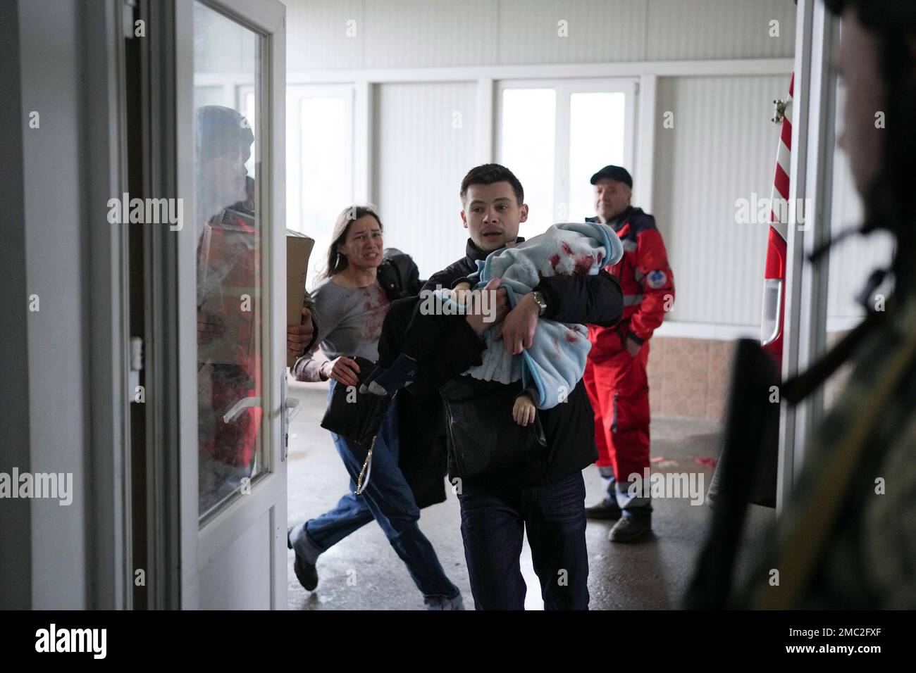Marina Yatsko, left, runs behind her boyfriend Fedor carrying her 18 ...