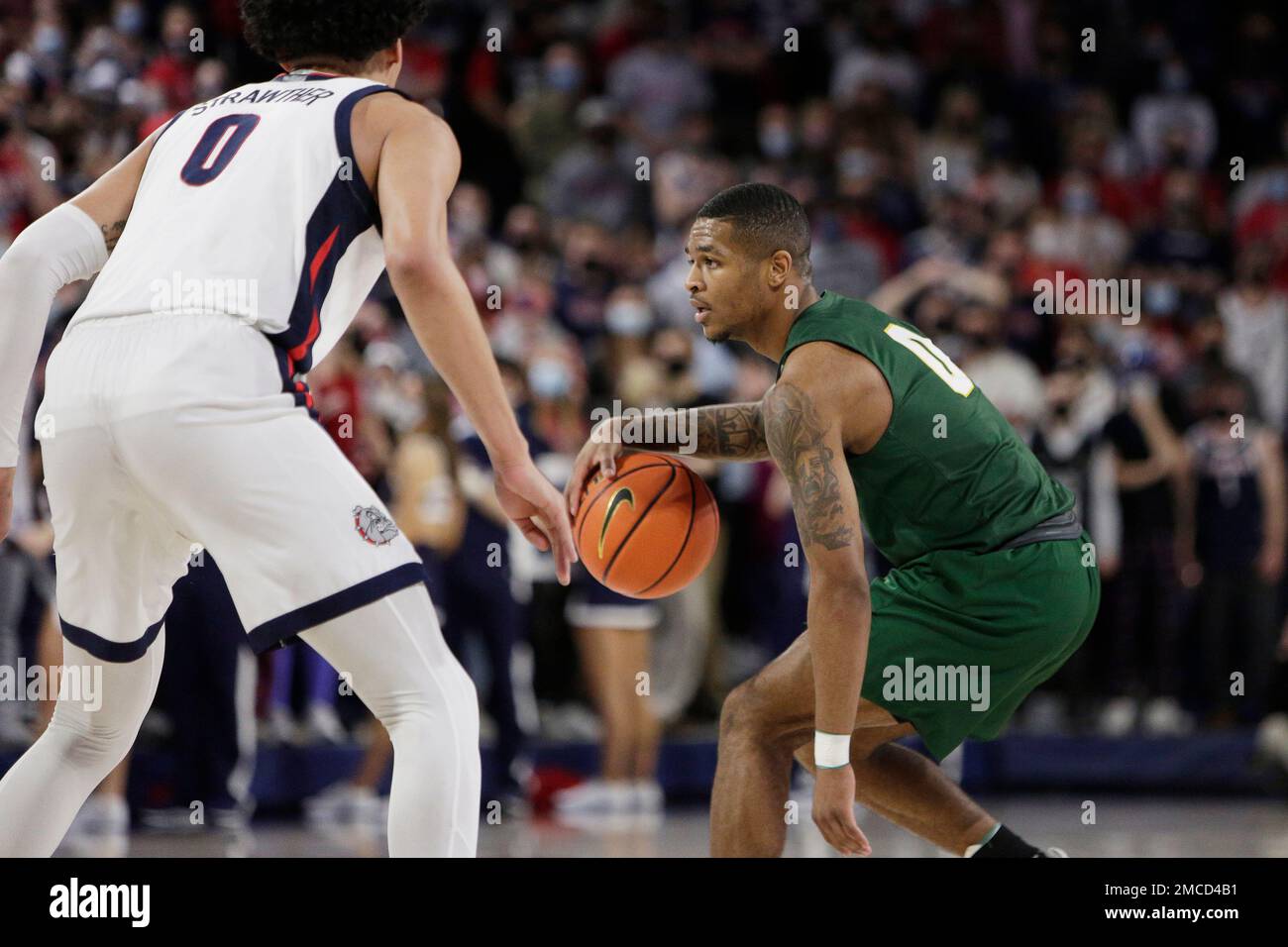 San Francisco guard Khalil Shabazz, right, controls the ball while ...