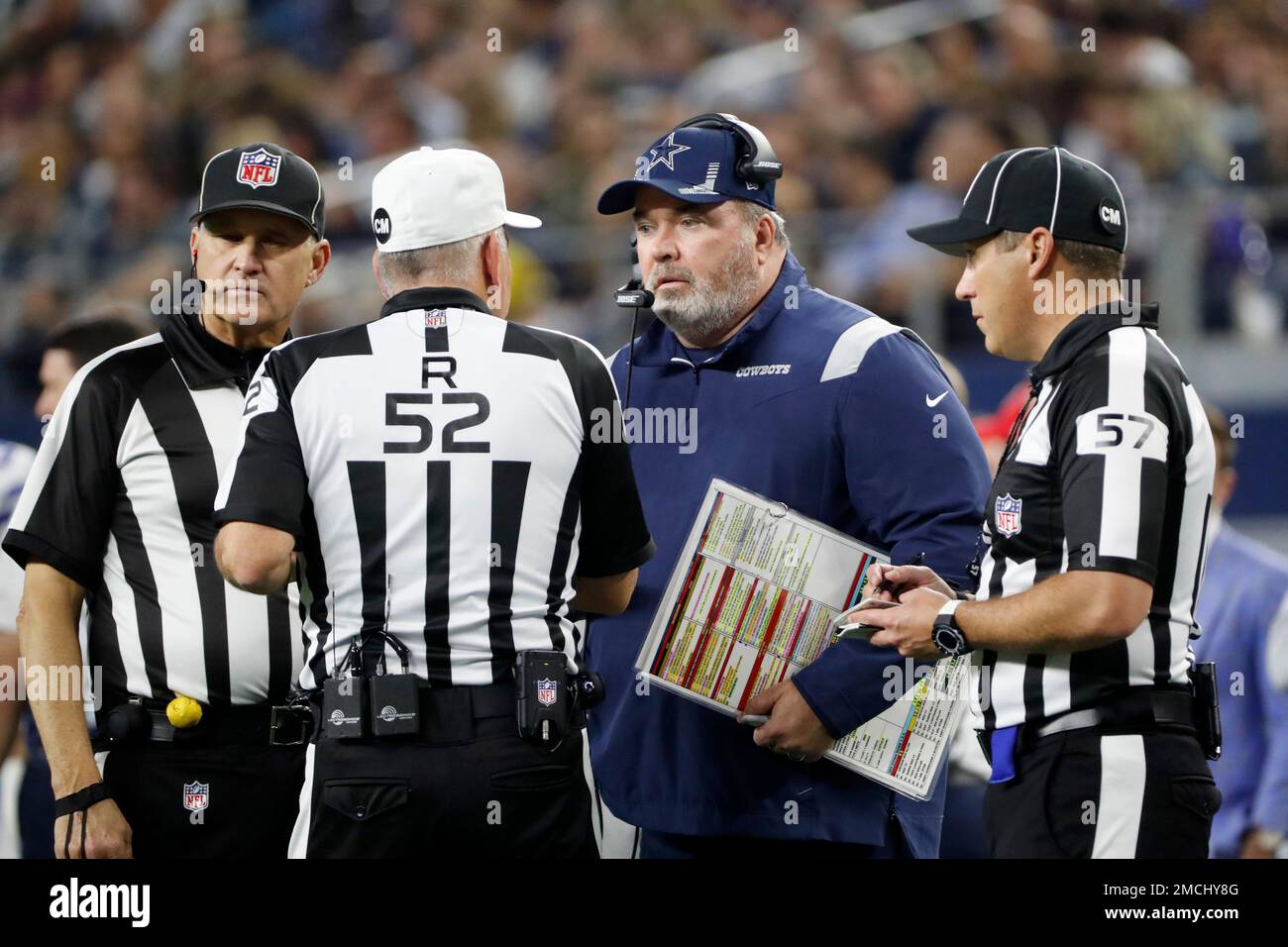 Dallas Cowboys head coach Mike McCarthy, center right, talks with ...
