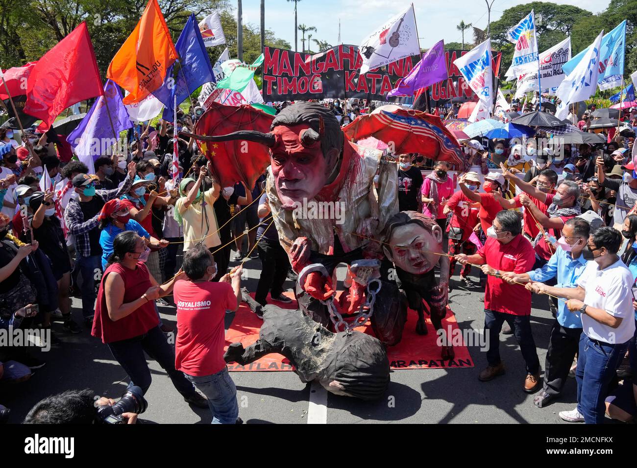 Activists destroy an effigy of Philippine President Rodrigo Duterte ...