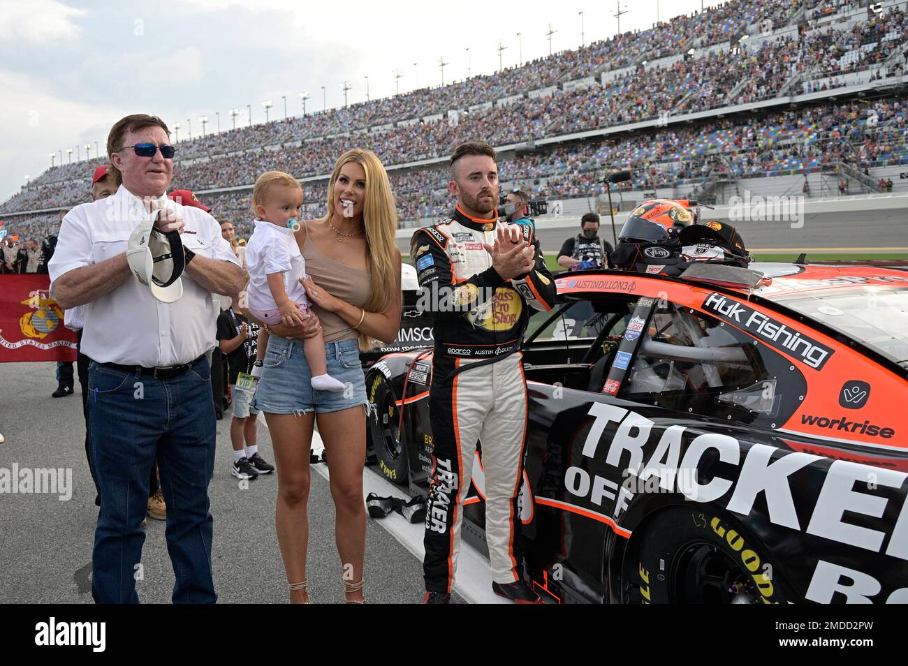 Austin Dillon stands next to his vehicle with his wife Whitney Dillon ...