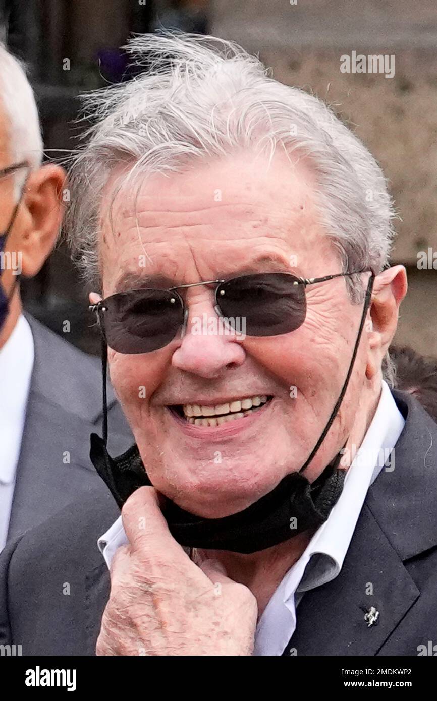 French actor Alain Delon removes his mask as he arrives at the Saint ...