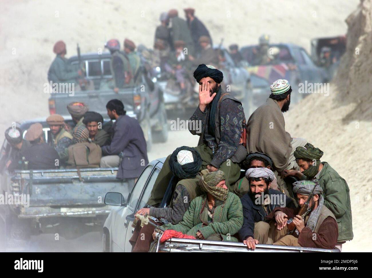 FILE - In this Nov. 24, 2001 file photo, a column of Taliban fighters ...
