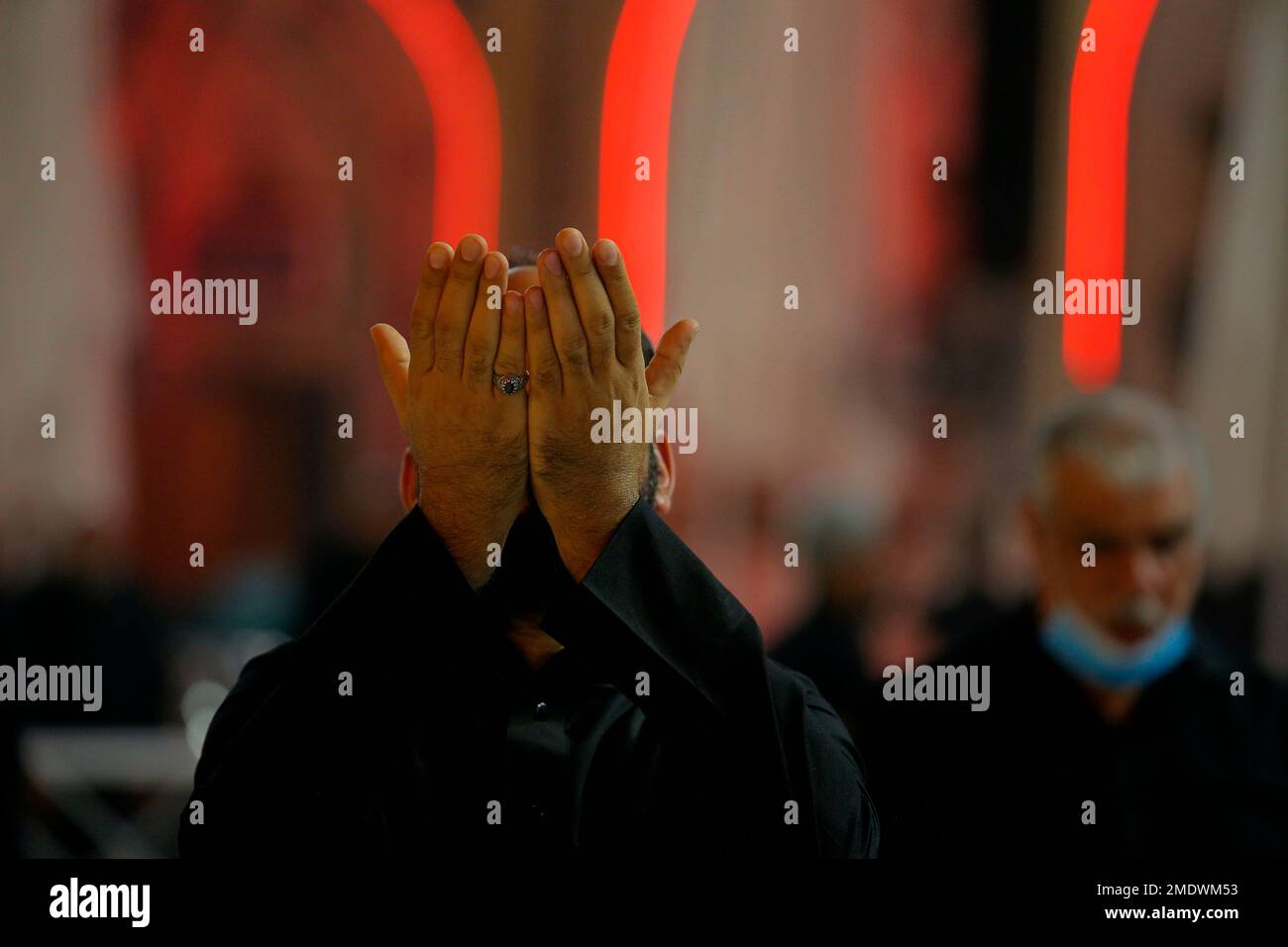 Shiite faithful pilgrims pray inside the holy shrine of Imam Ali, the ...