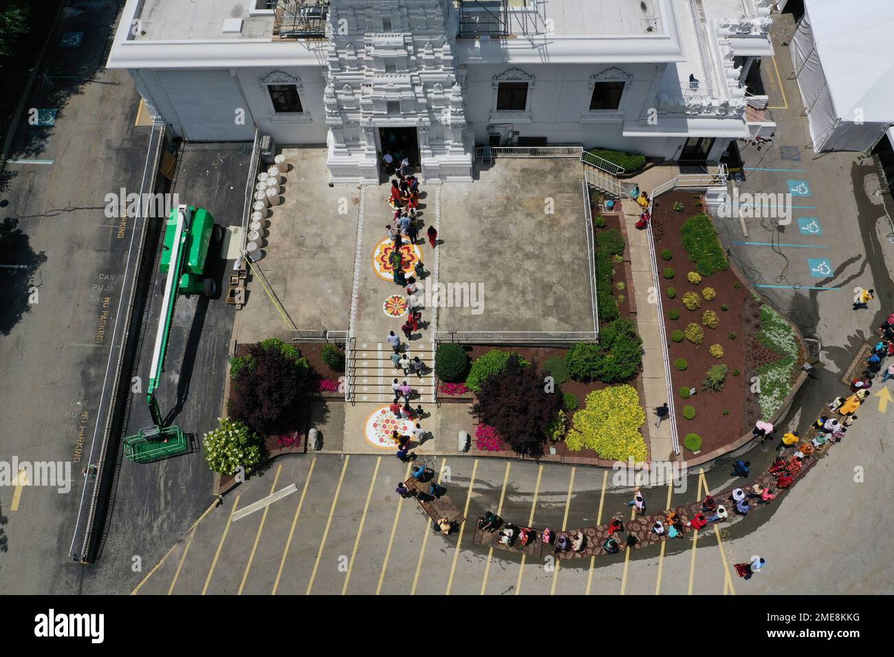 Devotees line up to enter the Sri Venkateswara Temple following the ...