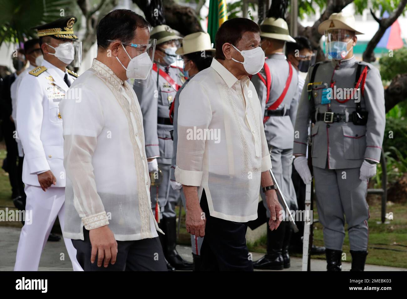 Philippine President Rodrigo Duterte, center right, walks during the ...
