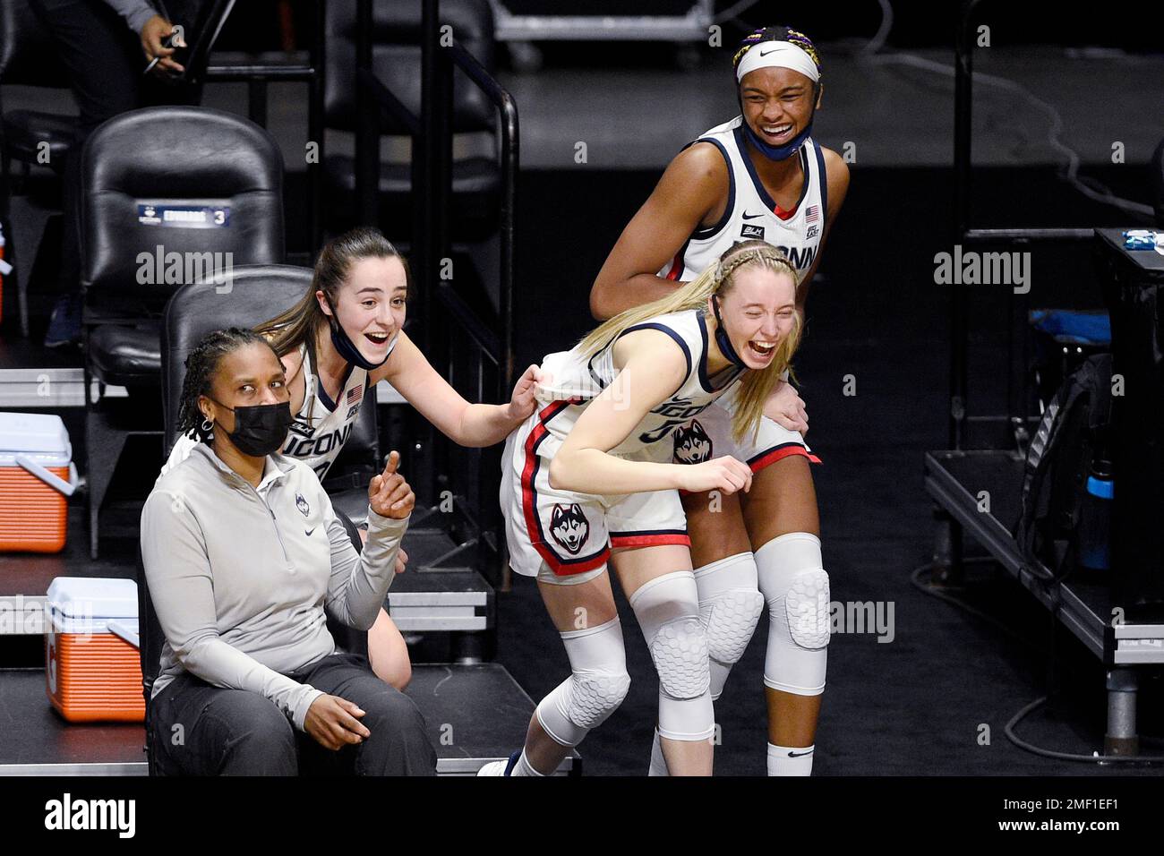 Connecticut's Nika Mühl, left, Connecticut's Paige Bueckers, center ...