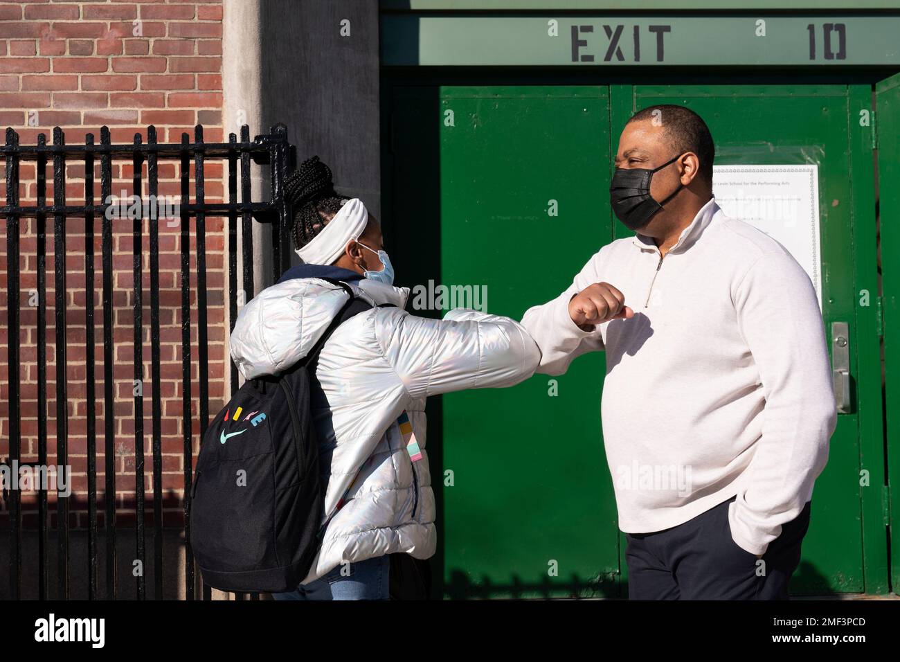 Linsey Johnson, right, a dean at Meyer Levin Middle School, greets a ...