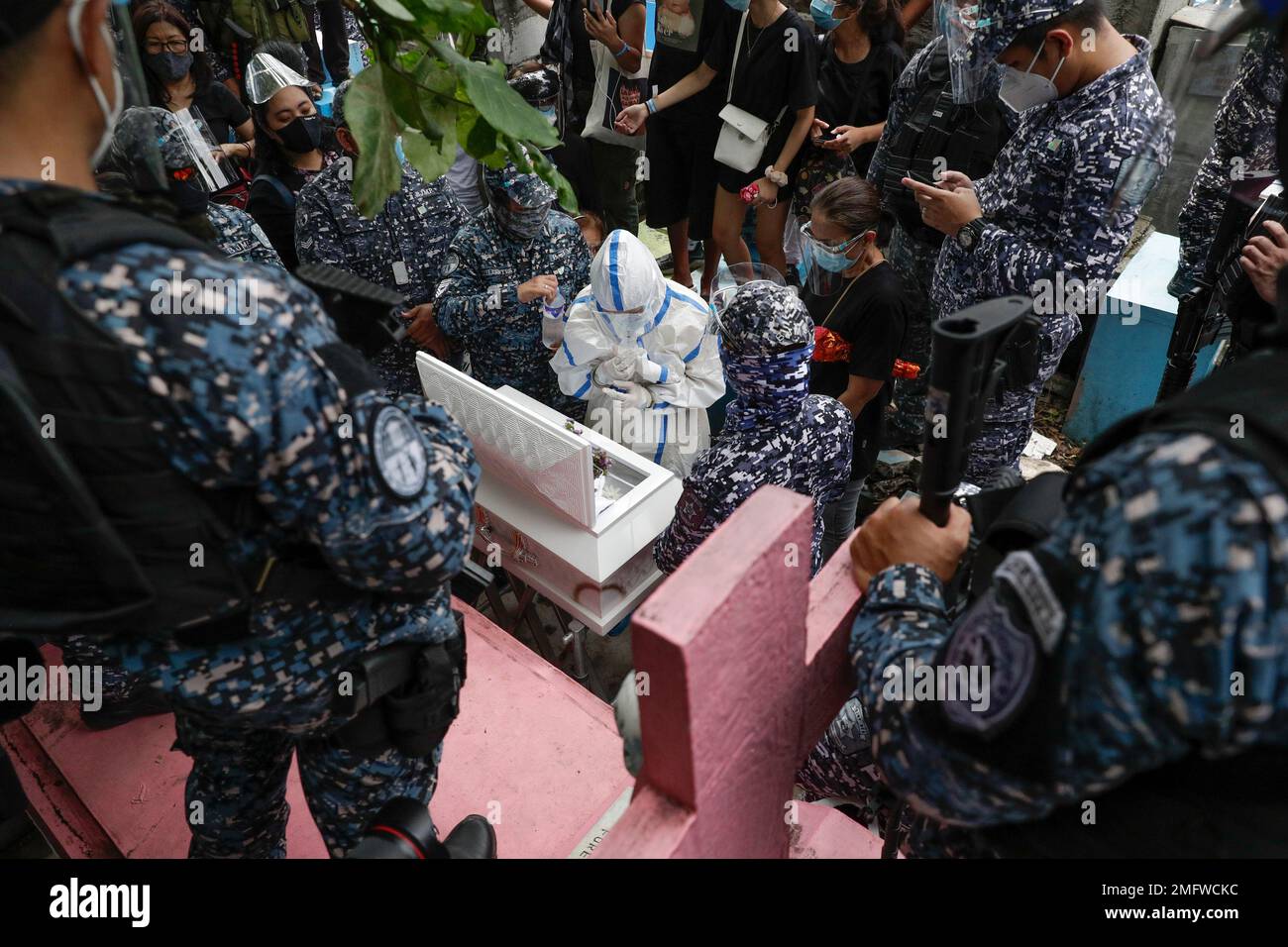 Police secure detained left-wing activist Reina Mae Nasino in handcuffs ...