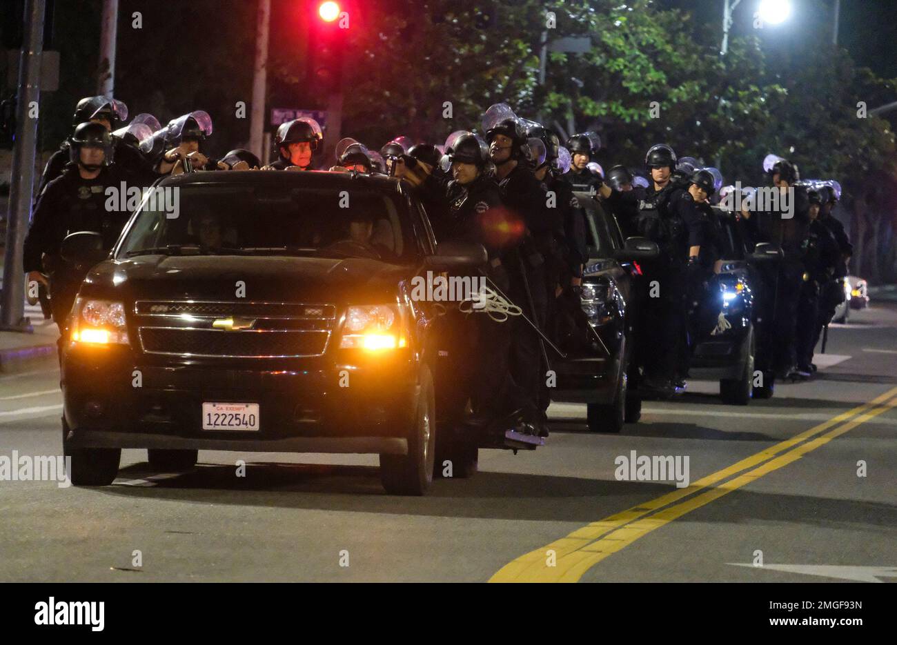 LAPD riot police stand by outside City Hall during a protest of the ...