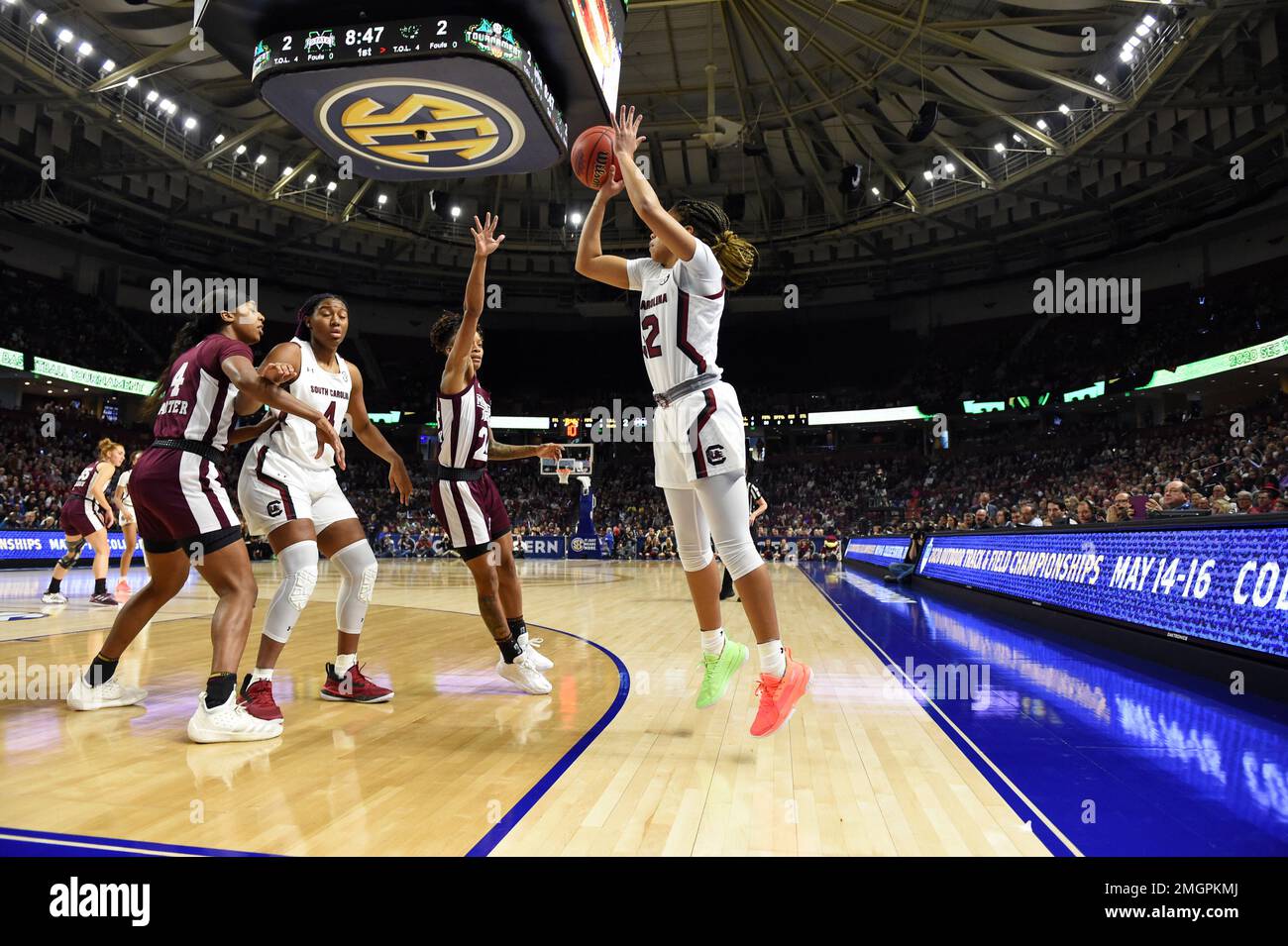 South Carolina's Tyasha Harris, right, shoots a three-point basketwhile defended by Mississippi ...