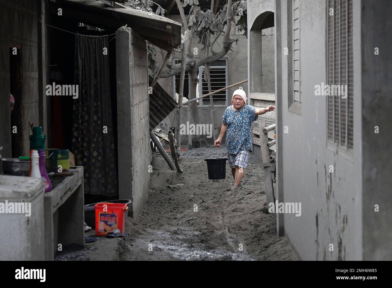 In this Jan. 14, 2020, photo, a resident fetches water at their ...