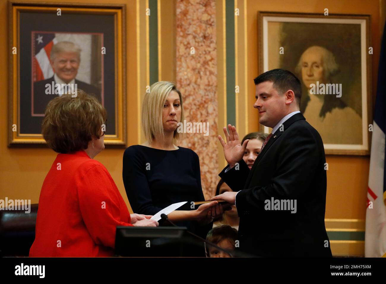State Rep. Linda Upmeyer, R-Clear Lake, left, administers the oath of ...