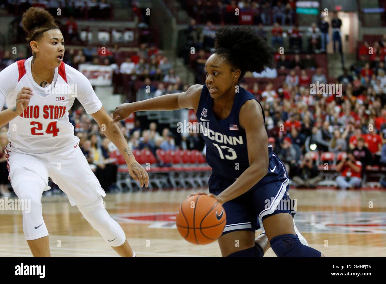 Connecticut guard Christyn Williams, right, drives against Ohio State ...