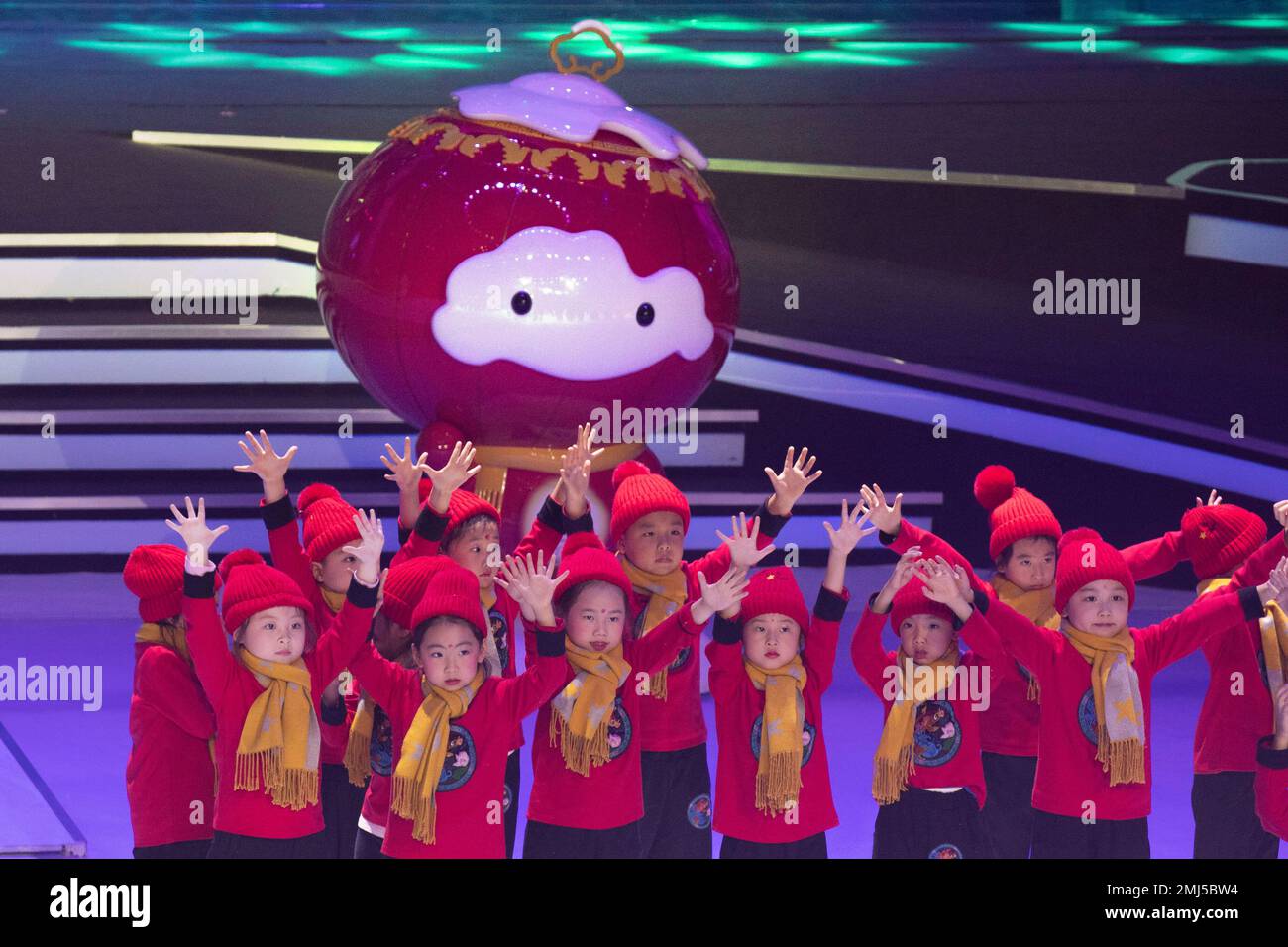 Children perform near the 2022 Winter Paralympic Games mascot Shuey ...