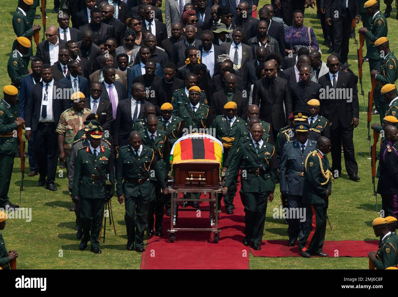 The casket of former president Robert Mugabe, covered by the national ...