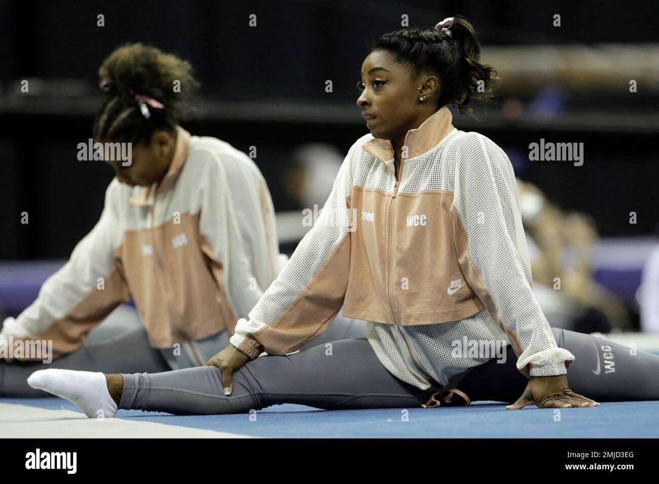 Simone Biles, right, and Jordan Chiles stretch during practice for the ...
