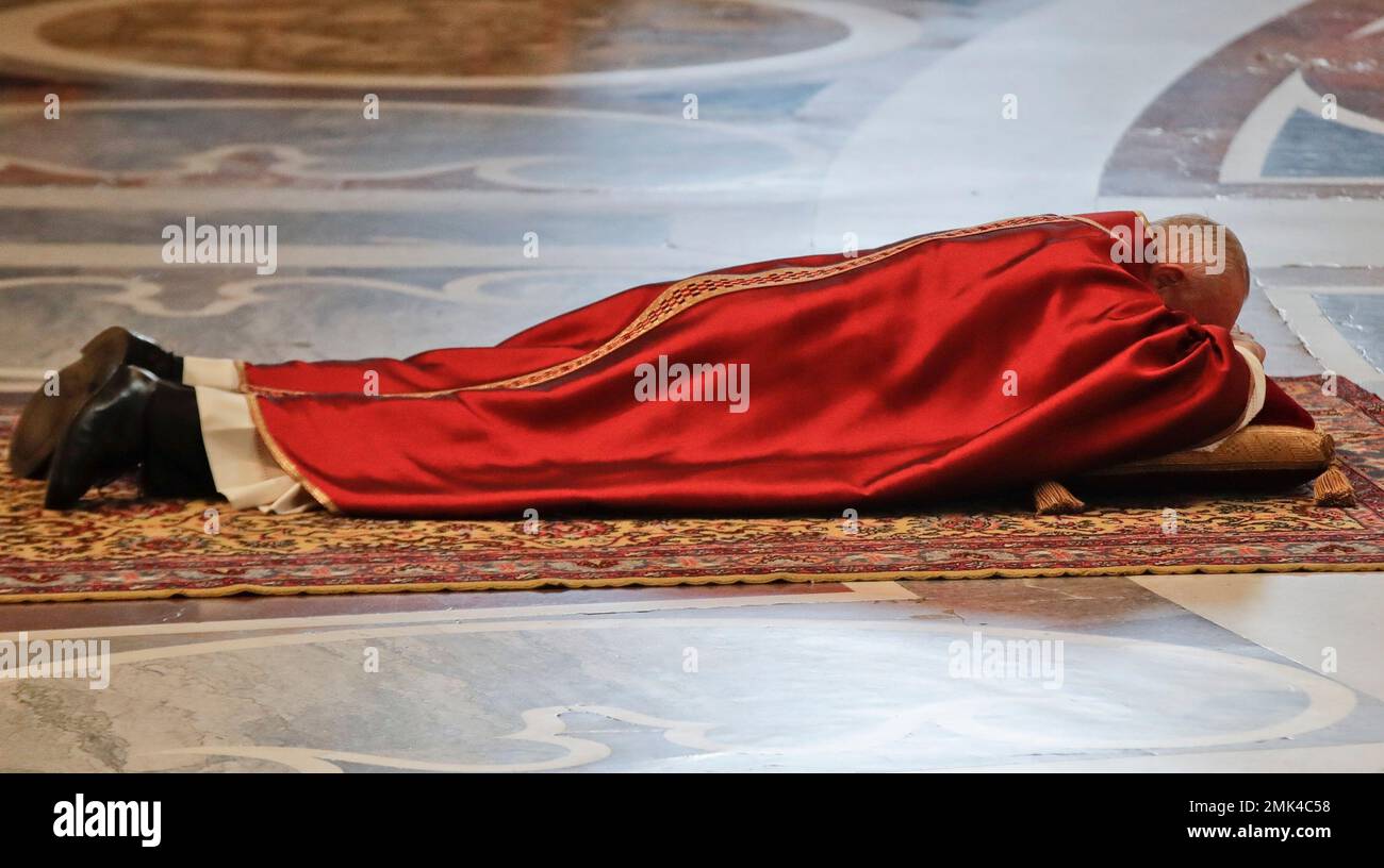 Pope Francis lies down in prayer prior to celebrate Mass for the ...
