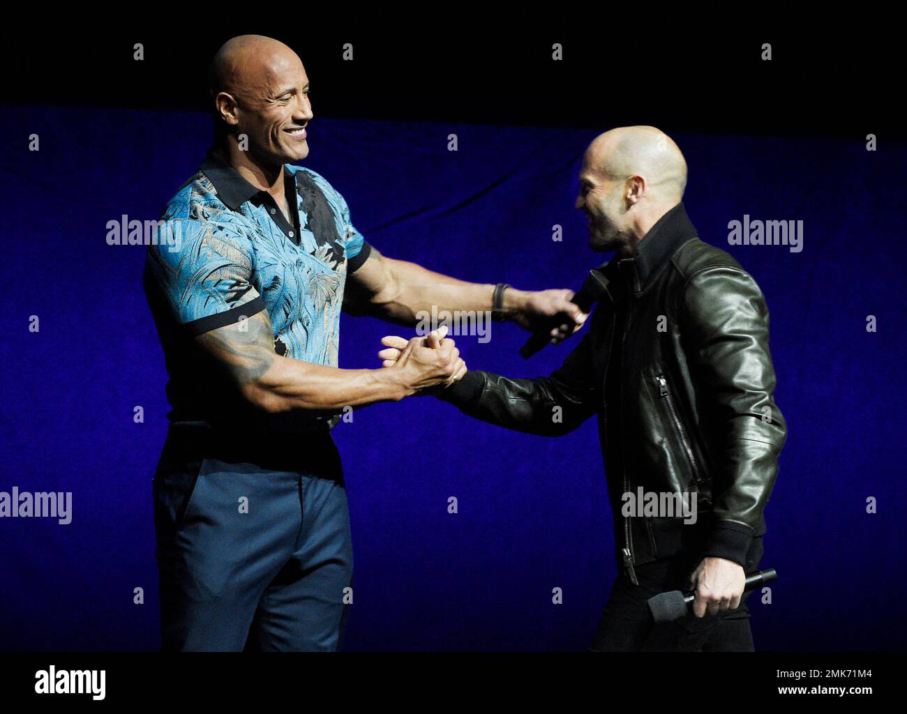 Dwayne Johnson, left, and Jason Statham, cast members in "Fast and Furious Presents: Hobbs ...