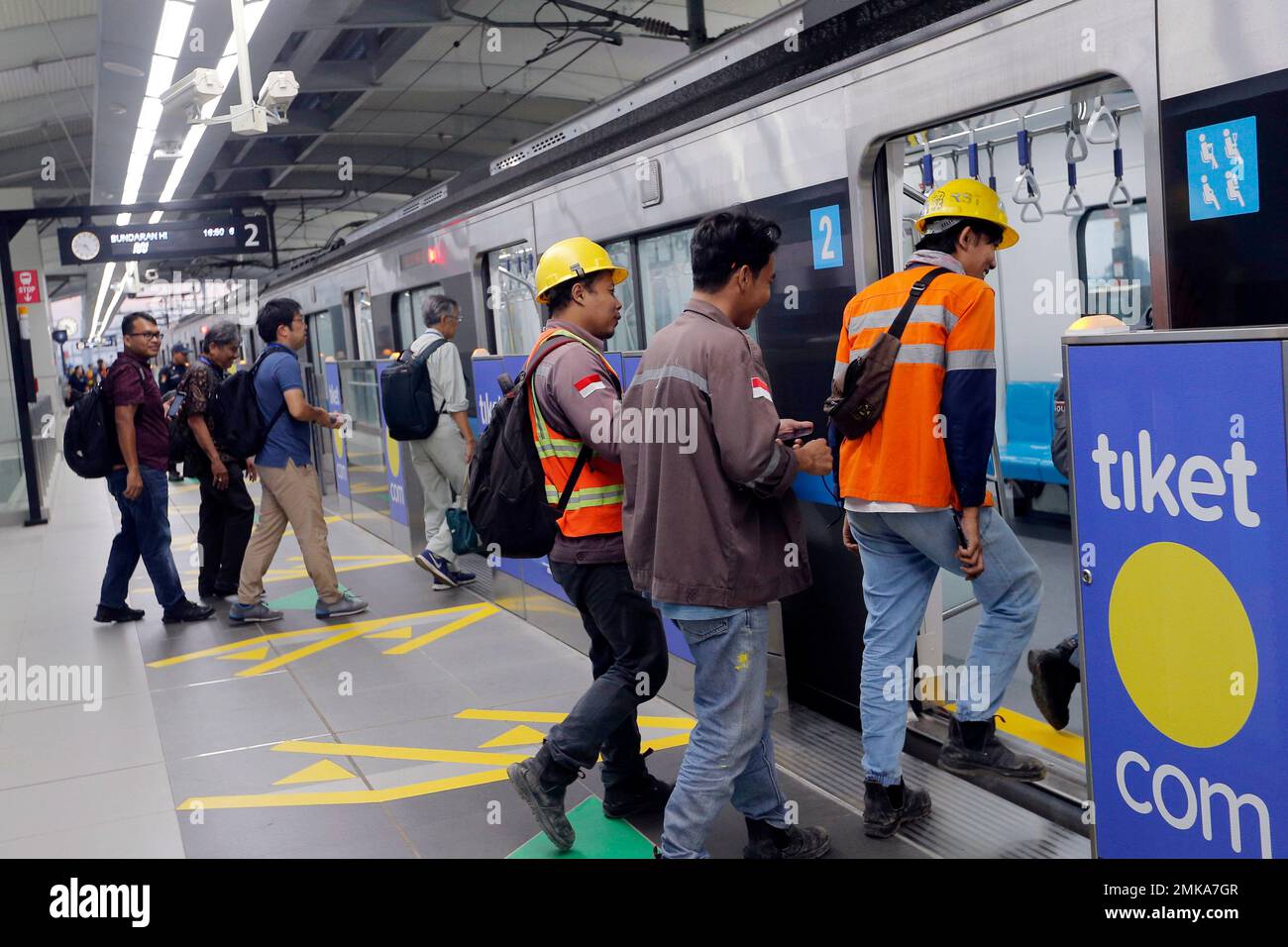 In this March 15, 2019, photo, passengers get on a Mass Rapid Transit (MRT) during a trial run ...