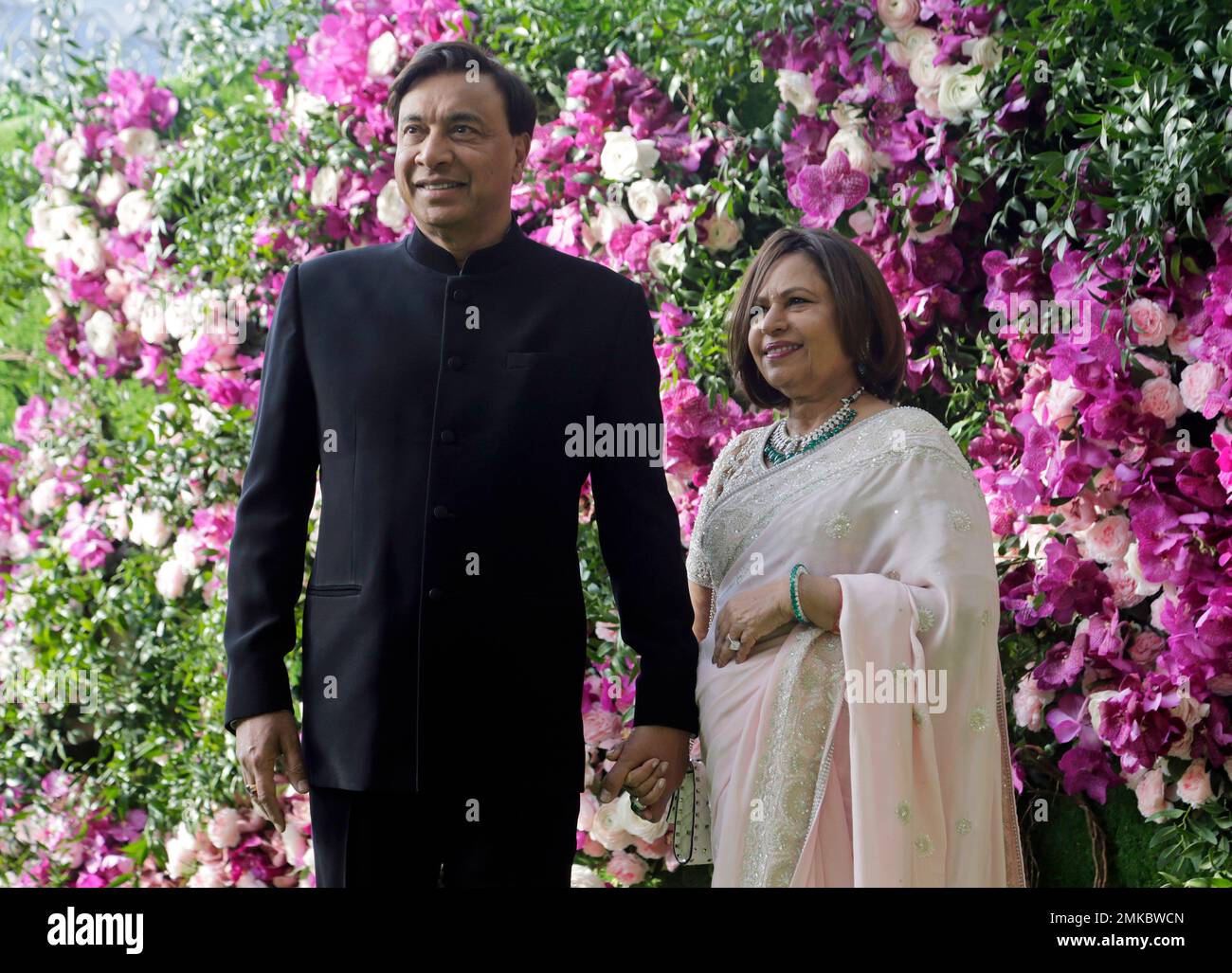 CEO of ArcelorMittal Lakshmi Mittal and his wife Usha Mittal stand for ...