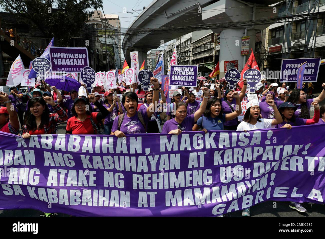Women activists shout slogans as they mark International Women's Day ...