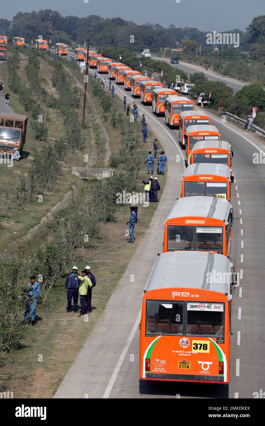 A fleet of buses line a road in an attempt to create a record of ...