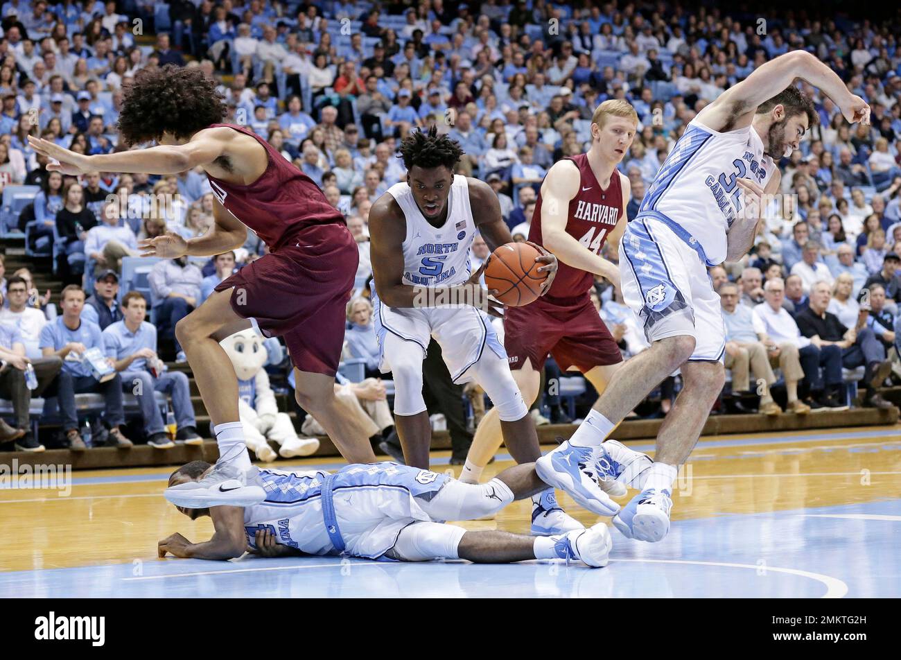 North Carolina's Nassir Little (5) grabs the ball while Kenny Williams ...