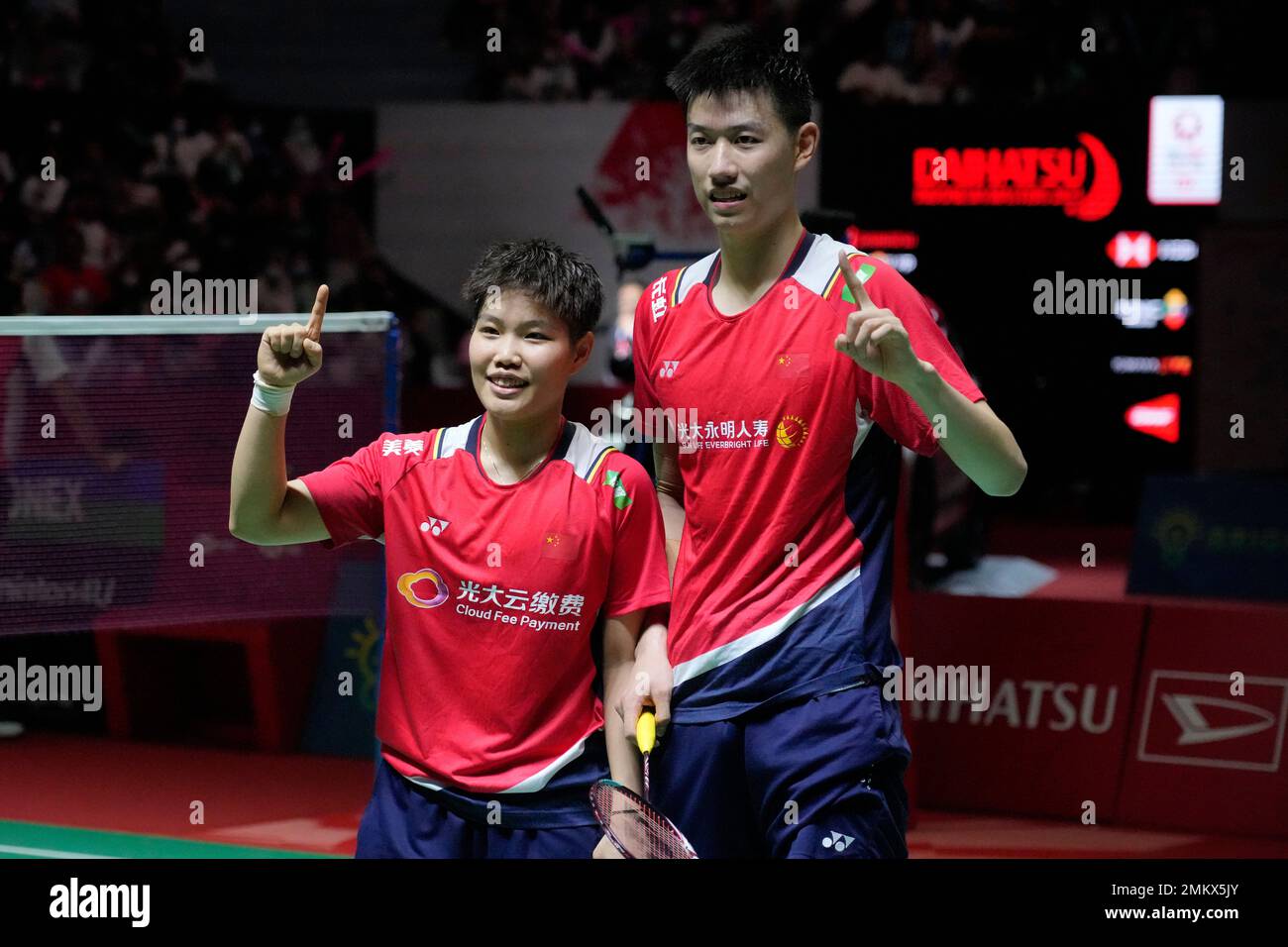 China's Feng Yan Zhe, right, and Huang Dong Ping celebrate after defeating China's Jiang Zhen ...