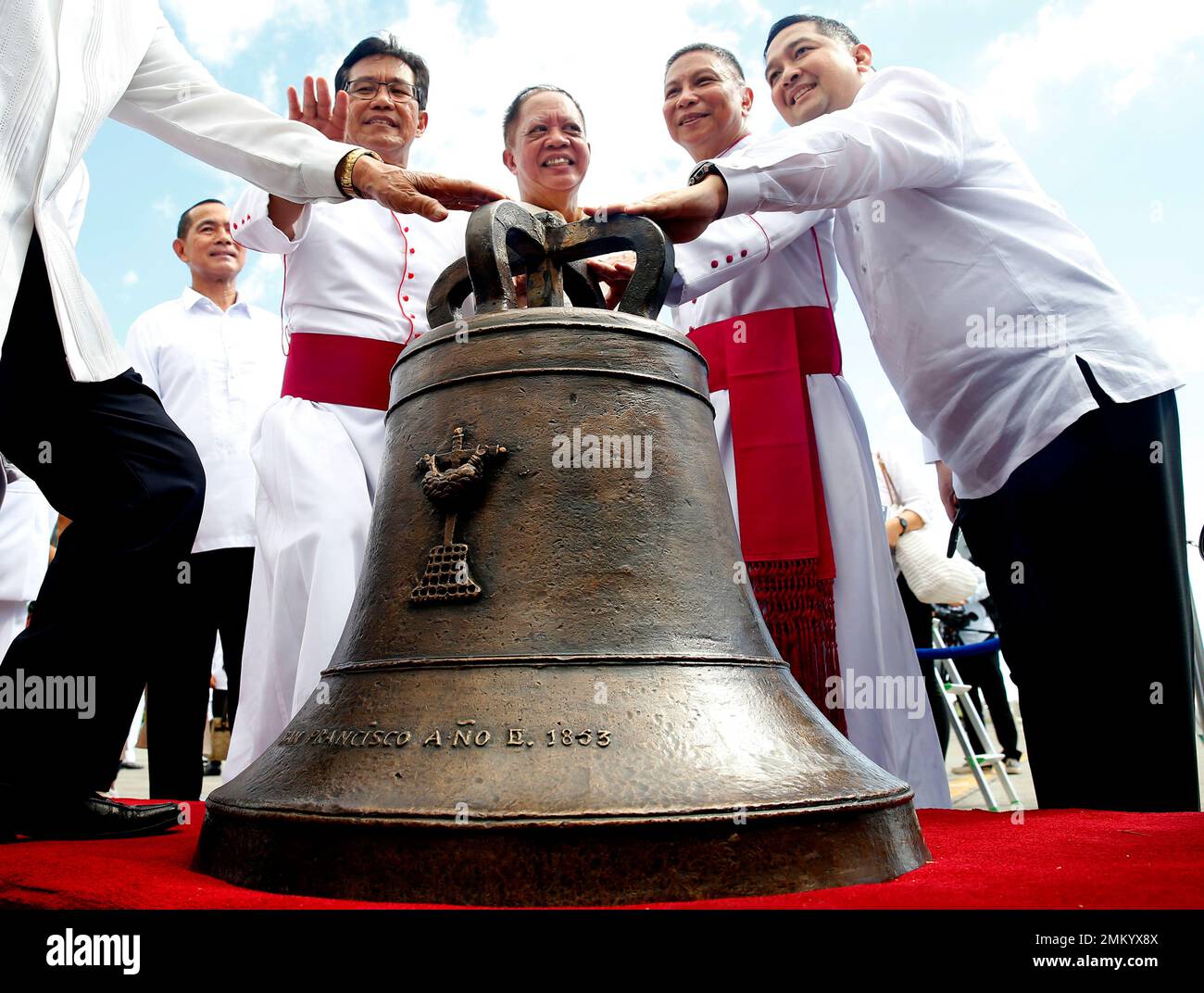 Roman Catholic priest Monsignor Pepe Quitorio, second from left, poses ...