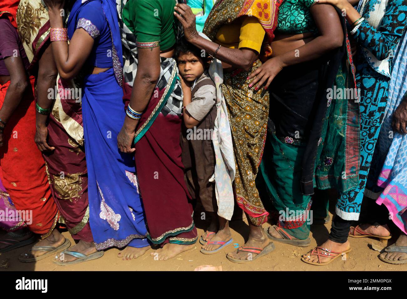 In this Dec. 5, 2018, file photo, a child waits in a queue for free ...