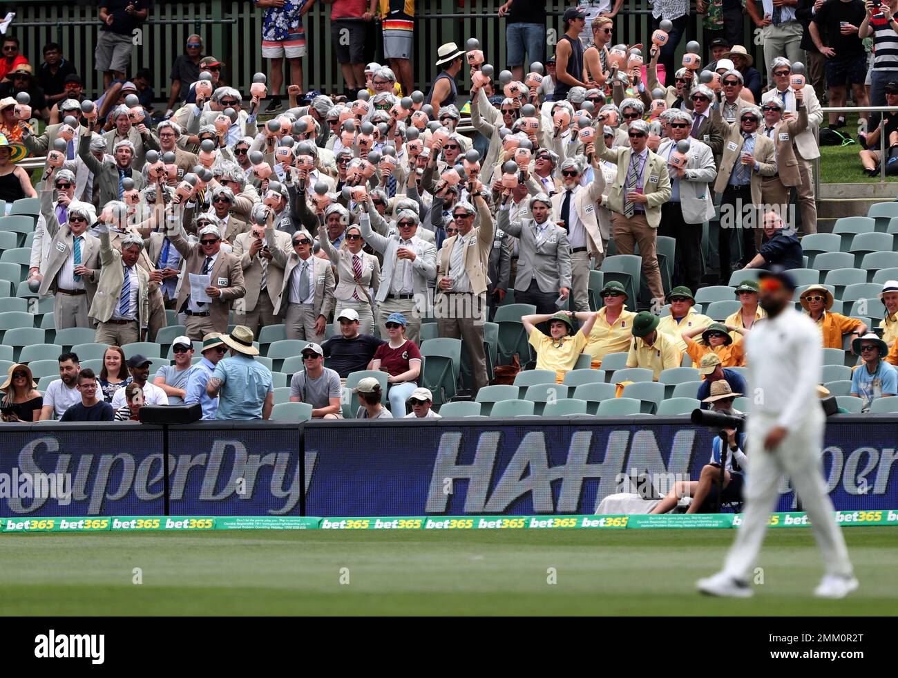 Spectators dressed as late Australian cricketer and television ...