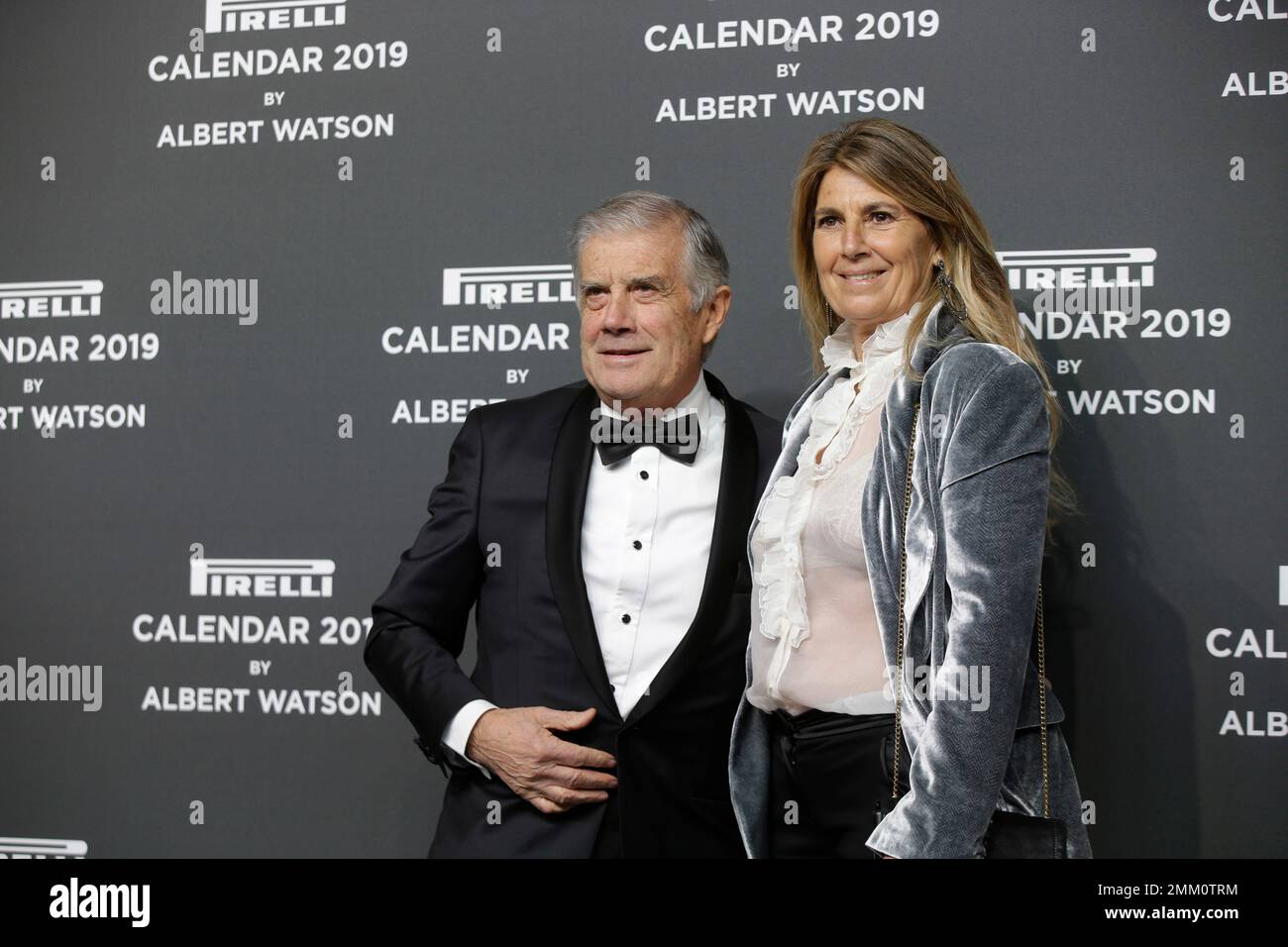 World champion motorcycle racer Giacomo Agostini is flanked by is wife ...
