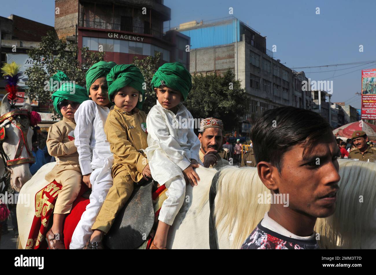 Indian Muslim children ride a horse during a procession to celebrate ...