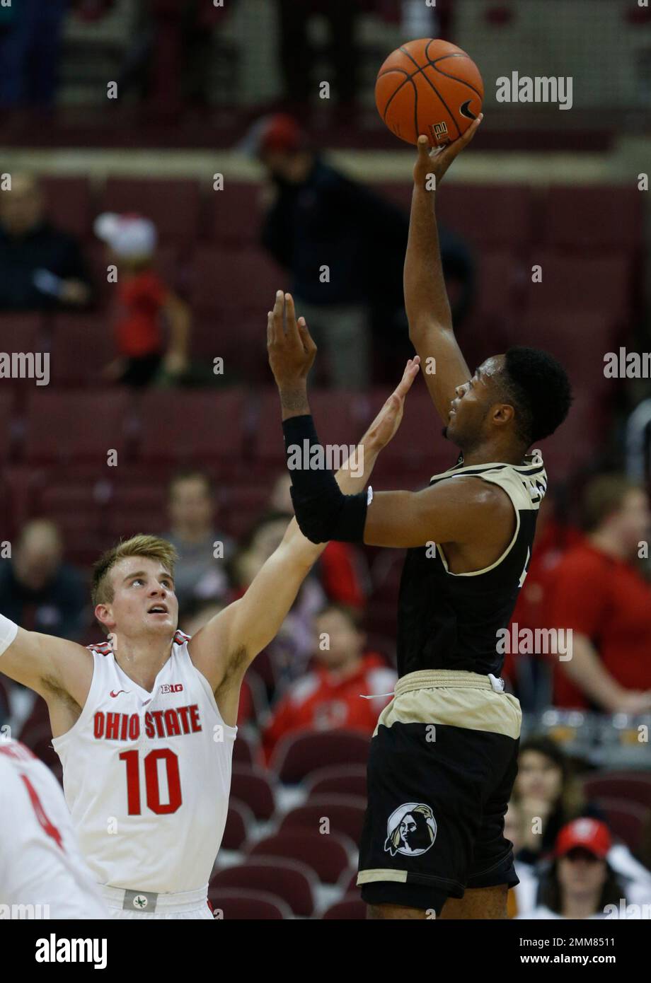 UNC Pembroke forward Akia Pruitt, right, goes up for a shot against ...