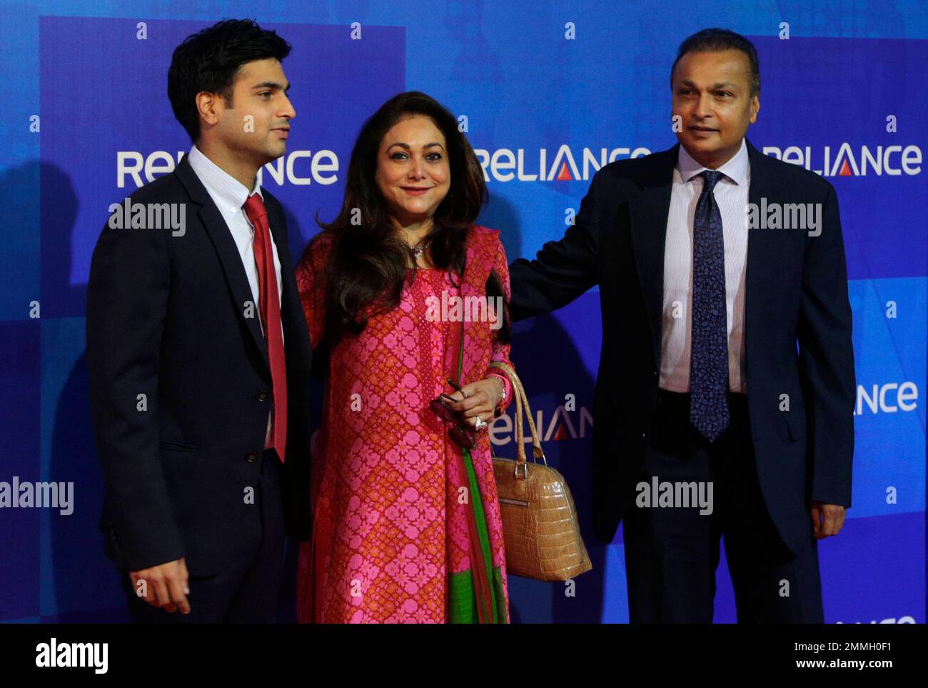 Anil Ambani, Chairman of Reliance Group, right, stands with his son Jai ...