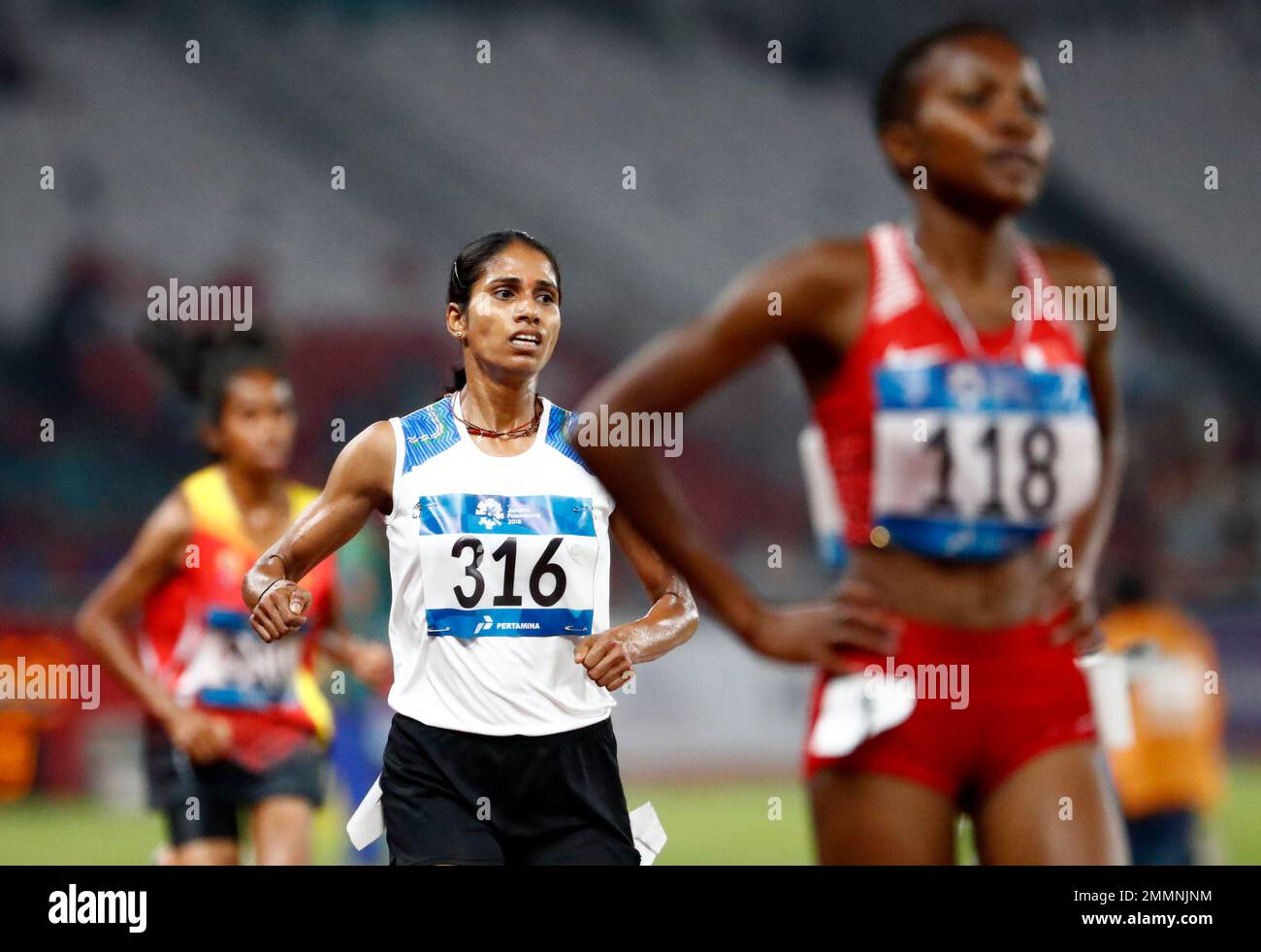 India's Sudha Singh crosses the finish line in second place in the women's 3000m steeplechase ...