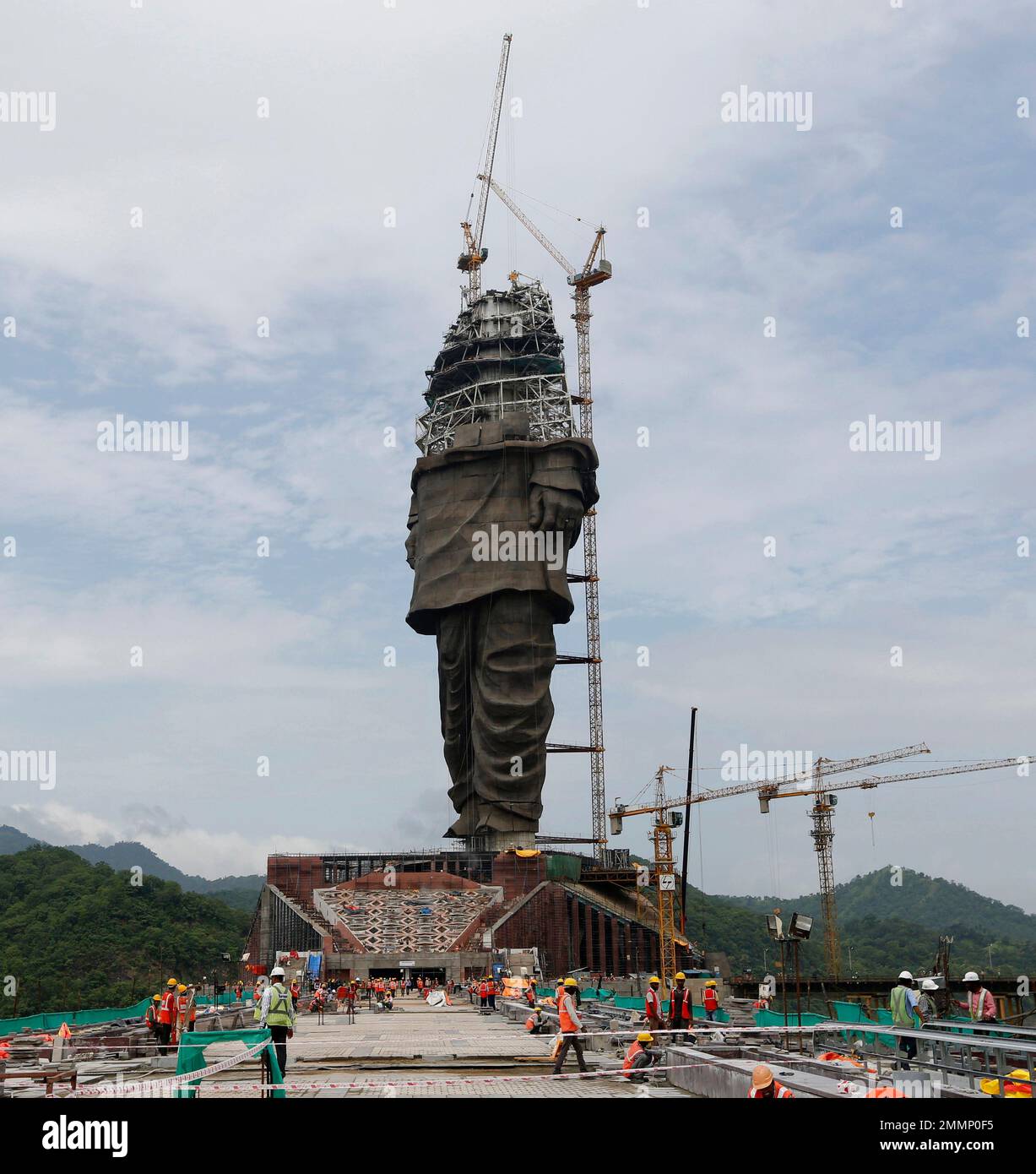 Indian workers build the Statue of Unity at Kevadiya Colony, about 200 ...