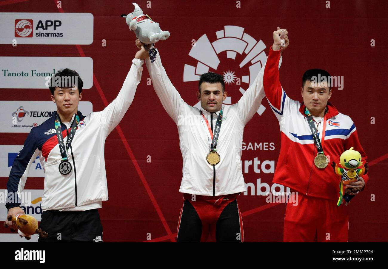 From left, silver medalist South Korea's Yeonhak Jang, gold medalist ...