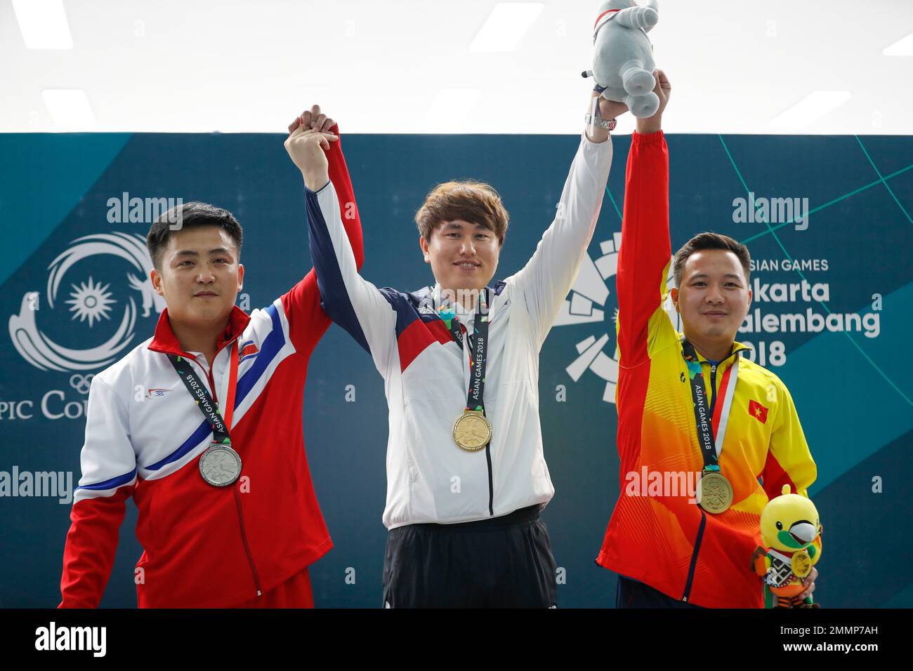 From left to right, silver medalist North Korea's Pak Myong Won, gold ...