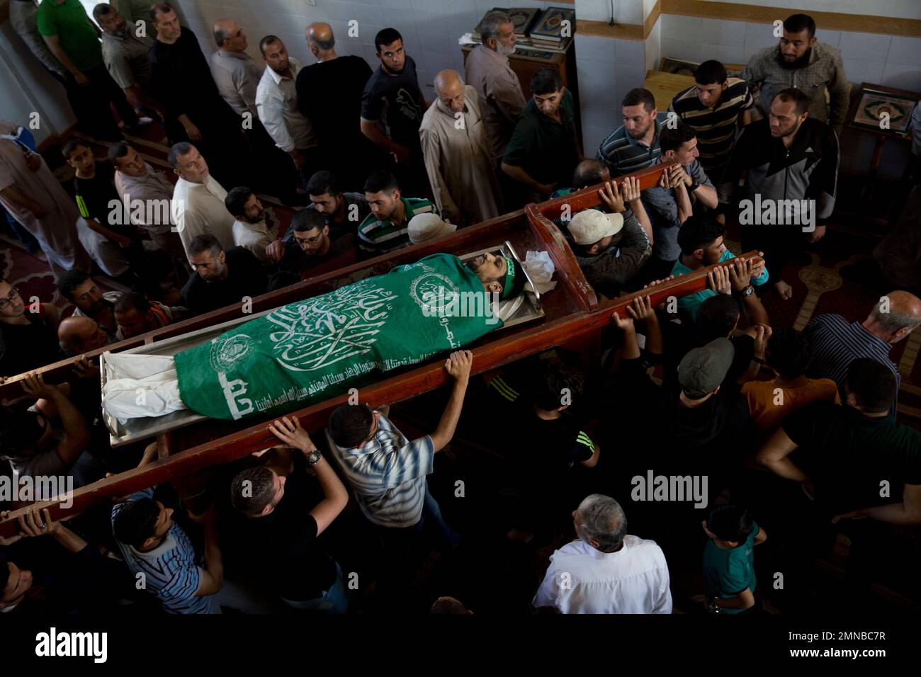 FILE - In this Monday, May 14, 2018 file photo, Palestinians carry the body of Mousab Abu Leila ...