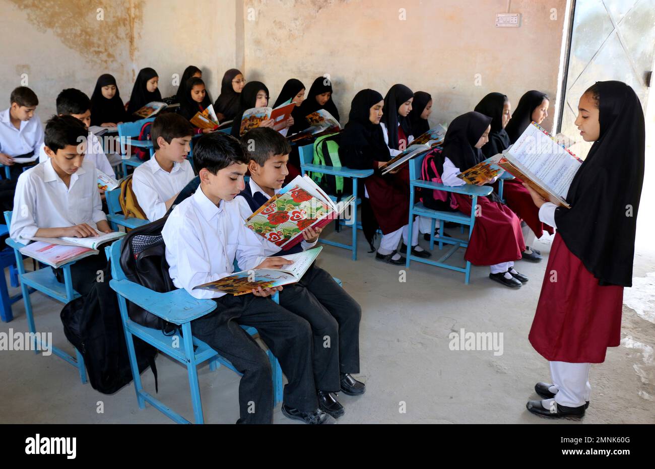 A Pakistani student teaches her class fellows at the school of Nobel ...