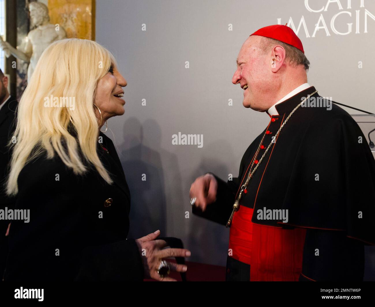 Cardinal Gianfranco Ravasi, right, talks to designer Donatella Versace ...