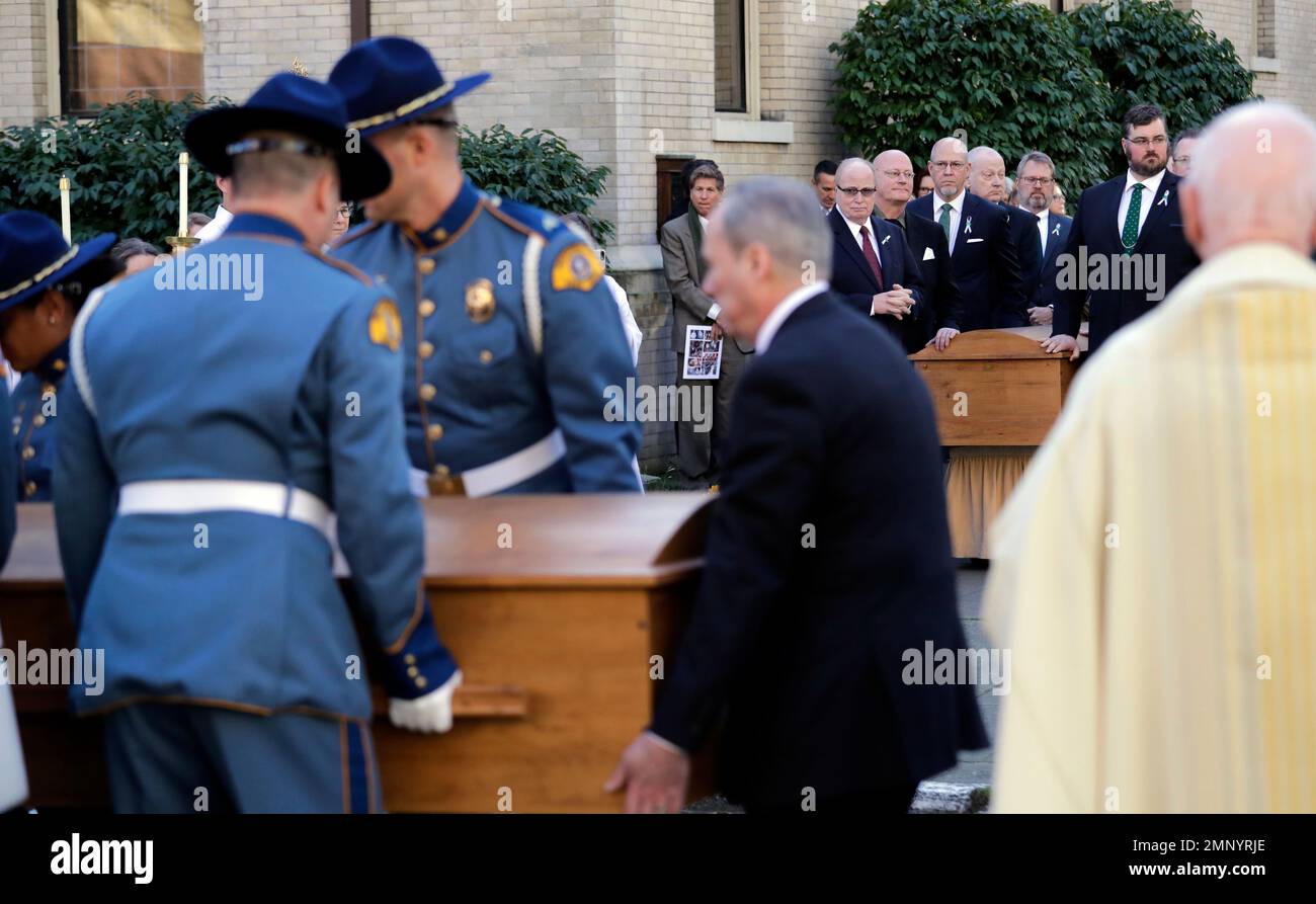 A Washington State Patrol honor guard moves the casket of former Gov ...