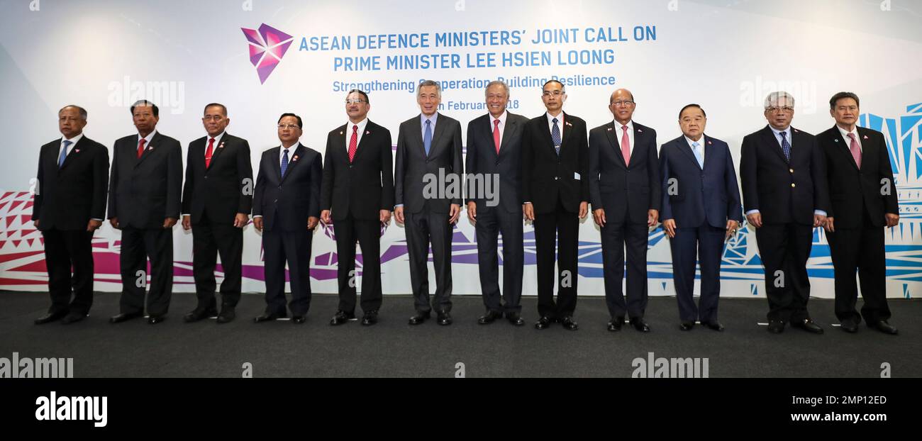 ASEAN defense ministers pose for a photo during a joint call on ...