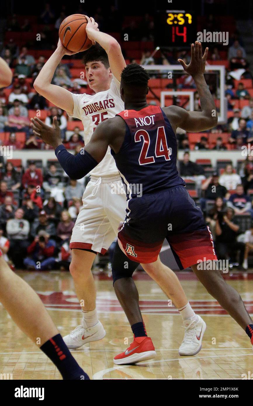 Washington State guard Carter Skaggs (35) holds the ball while defended ...