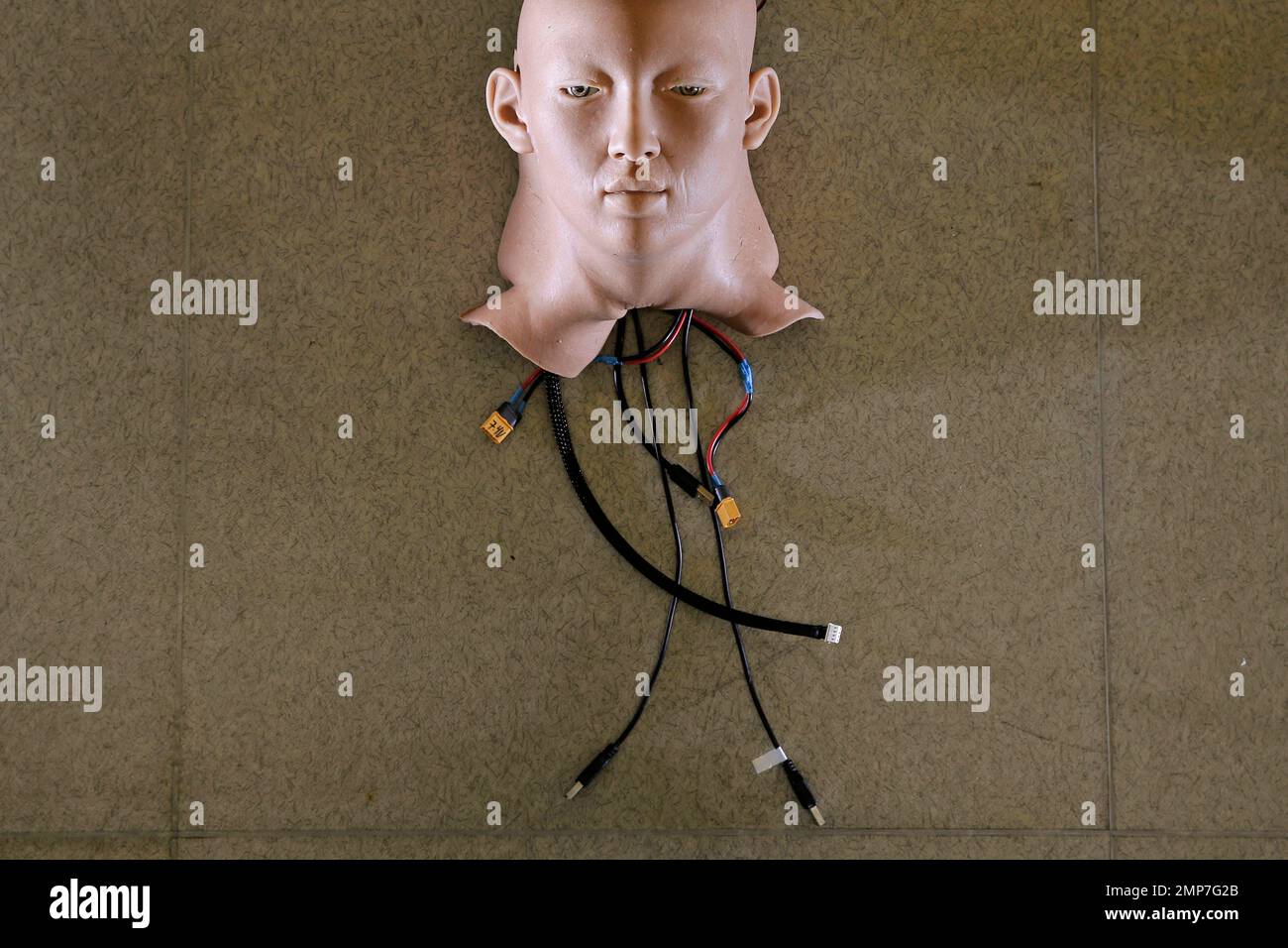 In this Sept. 28, 2017, photo, a robot head is covered by Hanson ...