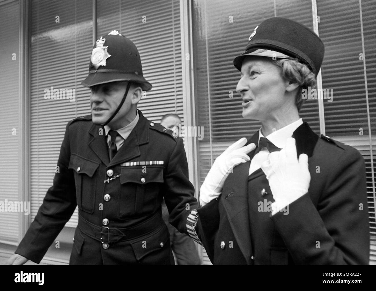 Policeman Henry McDonald leaves policewoman Sgt. Jose Seed alone as she ...
