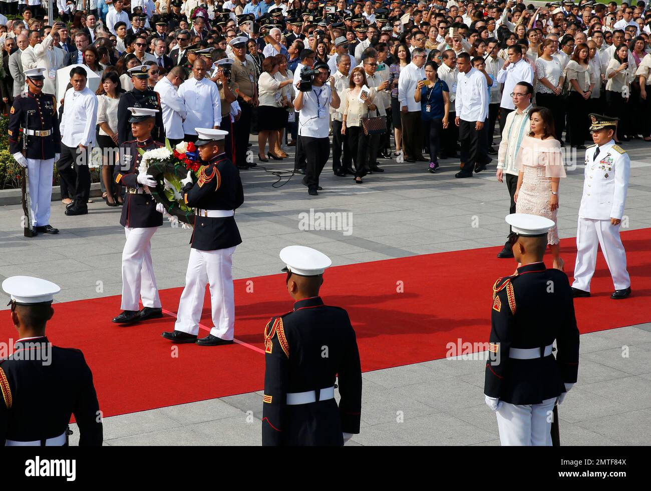 Philippine Vice President Leni Robredo, center, flanked by Armed Forces ...